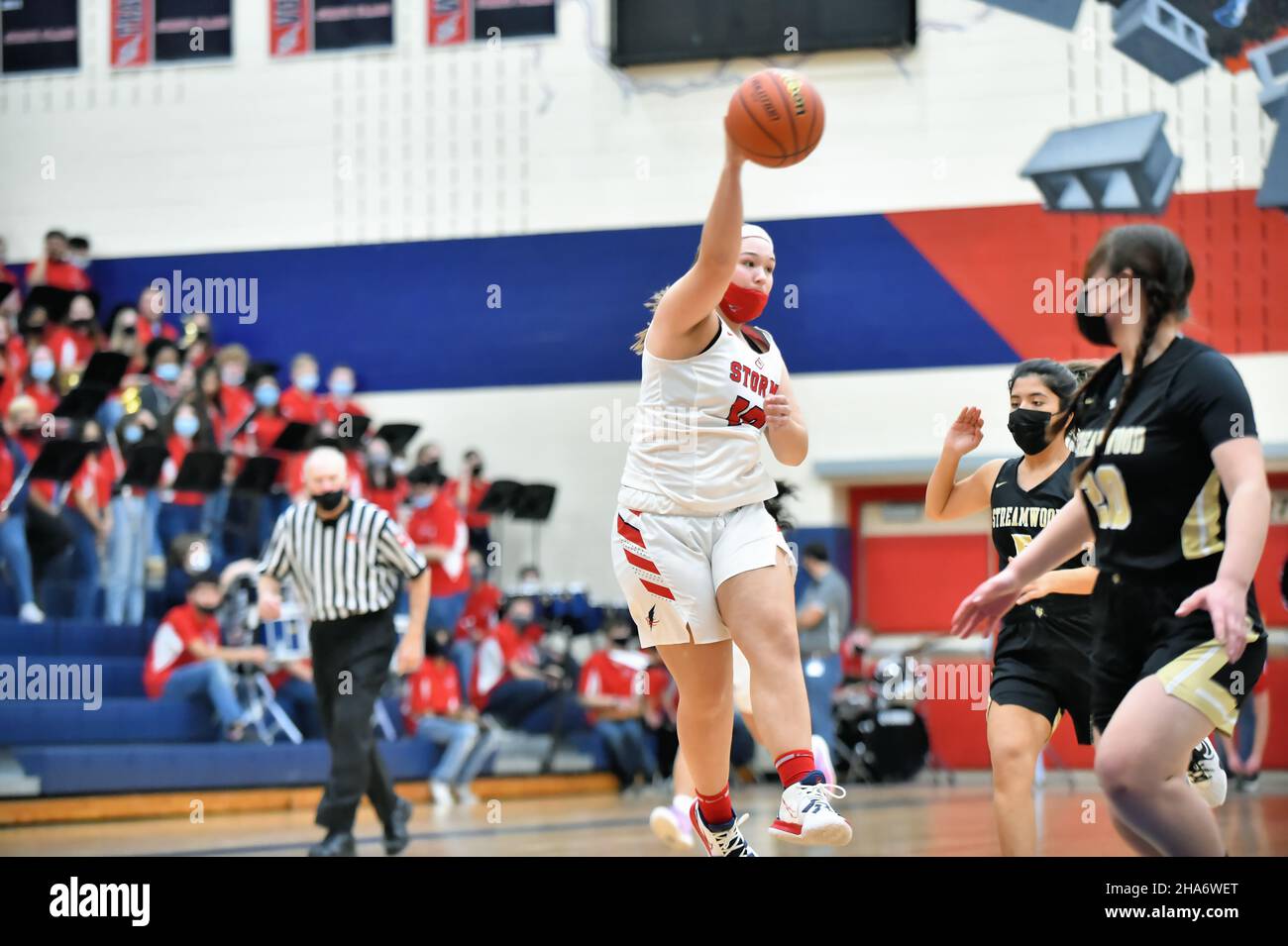 USA. Player directing a cross-court pass to an open teammate in an ...