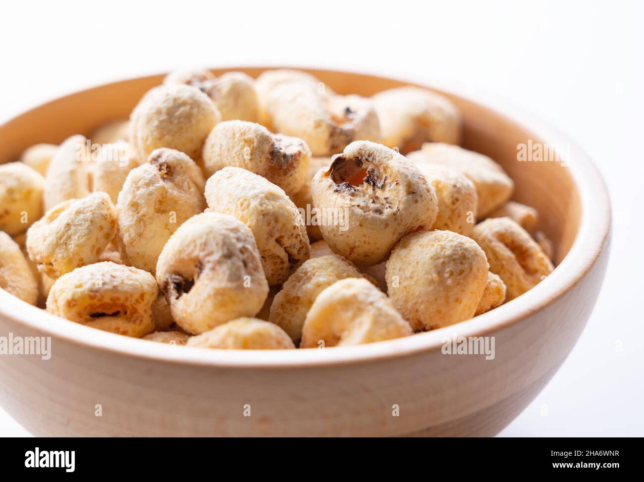 Jumbo corn baked goods in a wooden bowl on a white background Stock ...