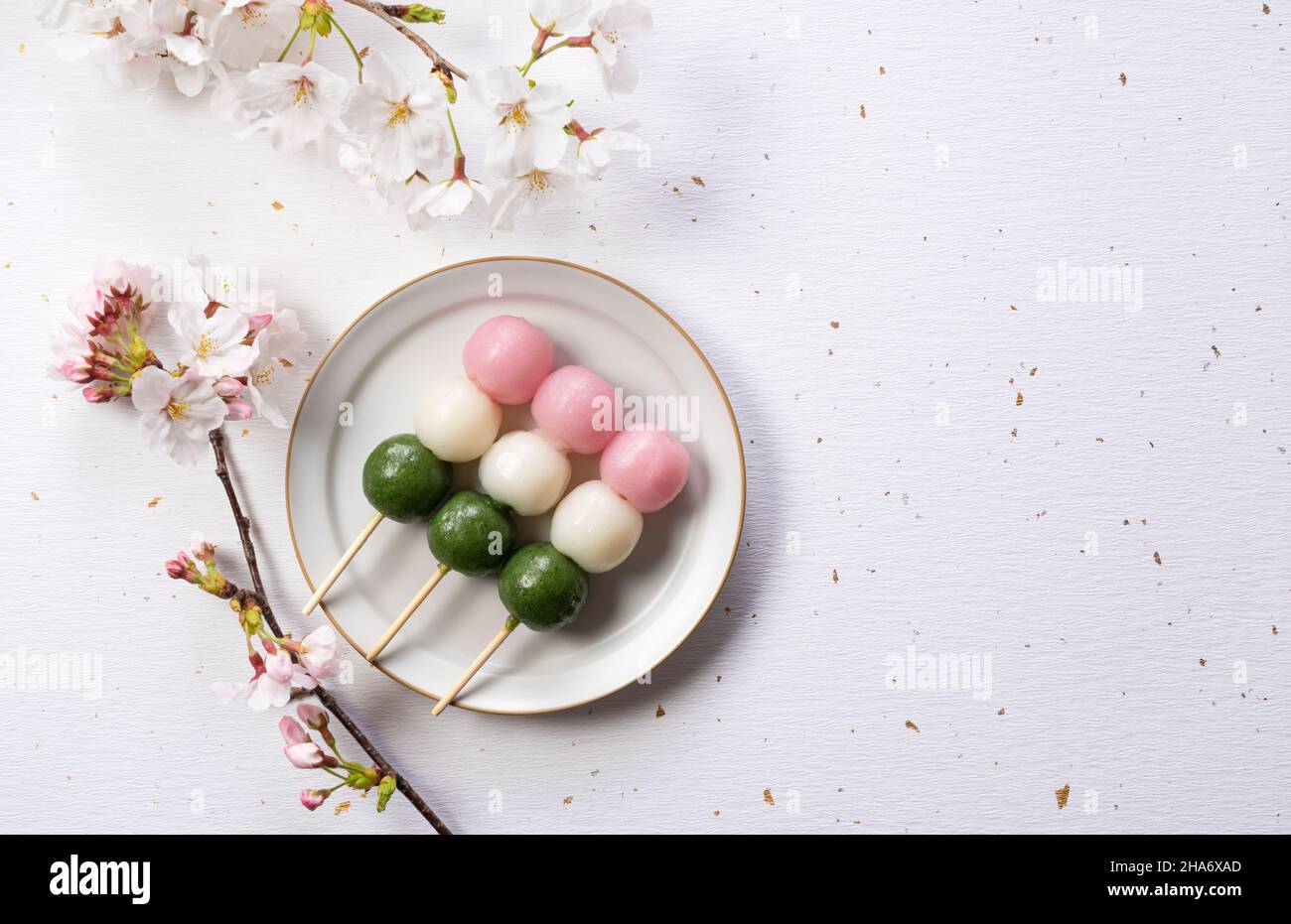 Tricolor dumplings placed on a white background. An image of Japanese ...