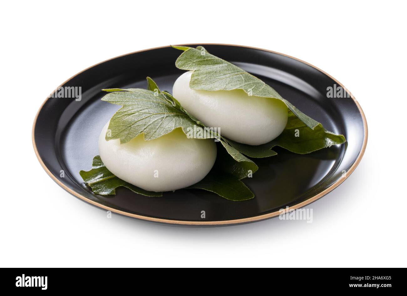 Kashiwa-mochi rice cake placed on a white background. Kashiwa Mochi is ...