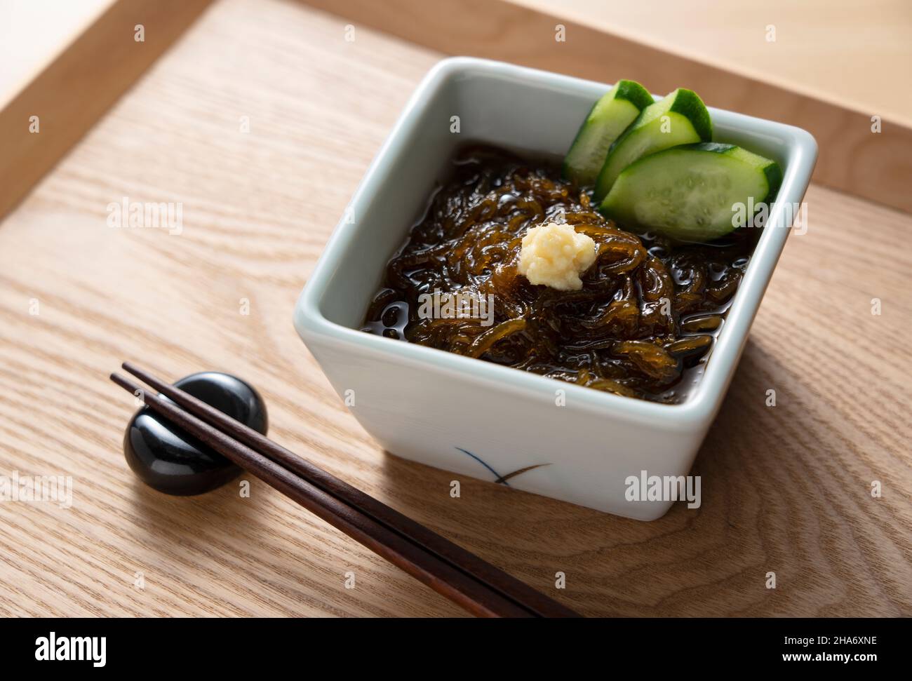 Mozuku placed on a wooden tray. The image of Japanese food.Mozuku is an ...