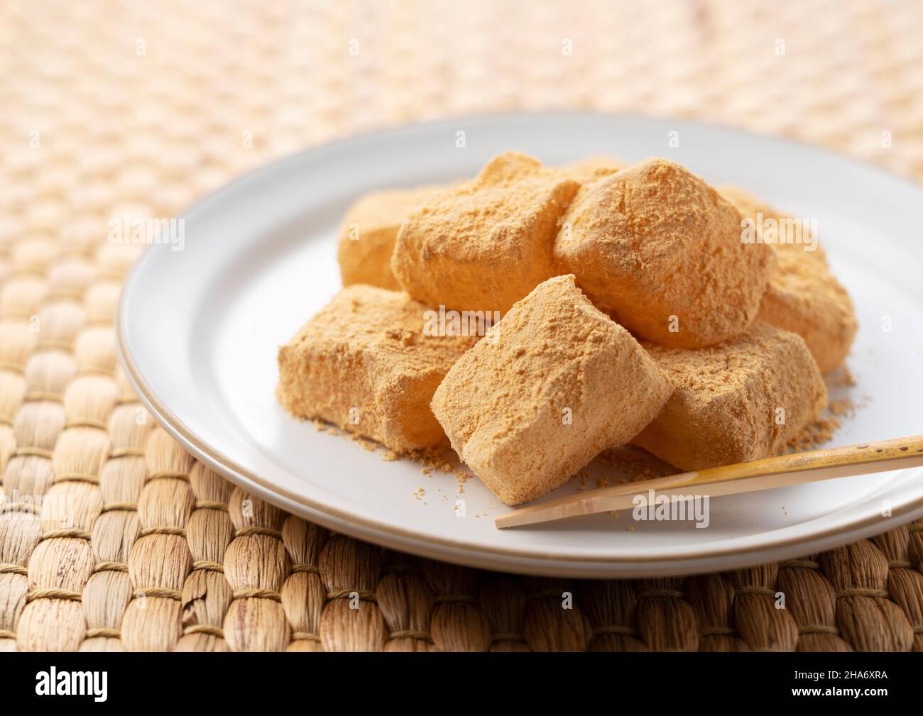 Warabi Mochi placed on a Japanese placemat. Warabimochi is a ...