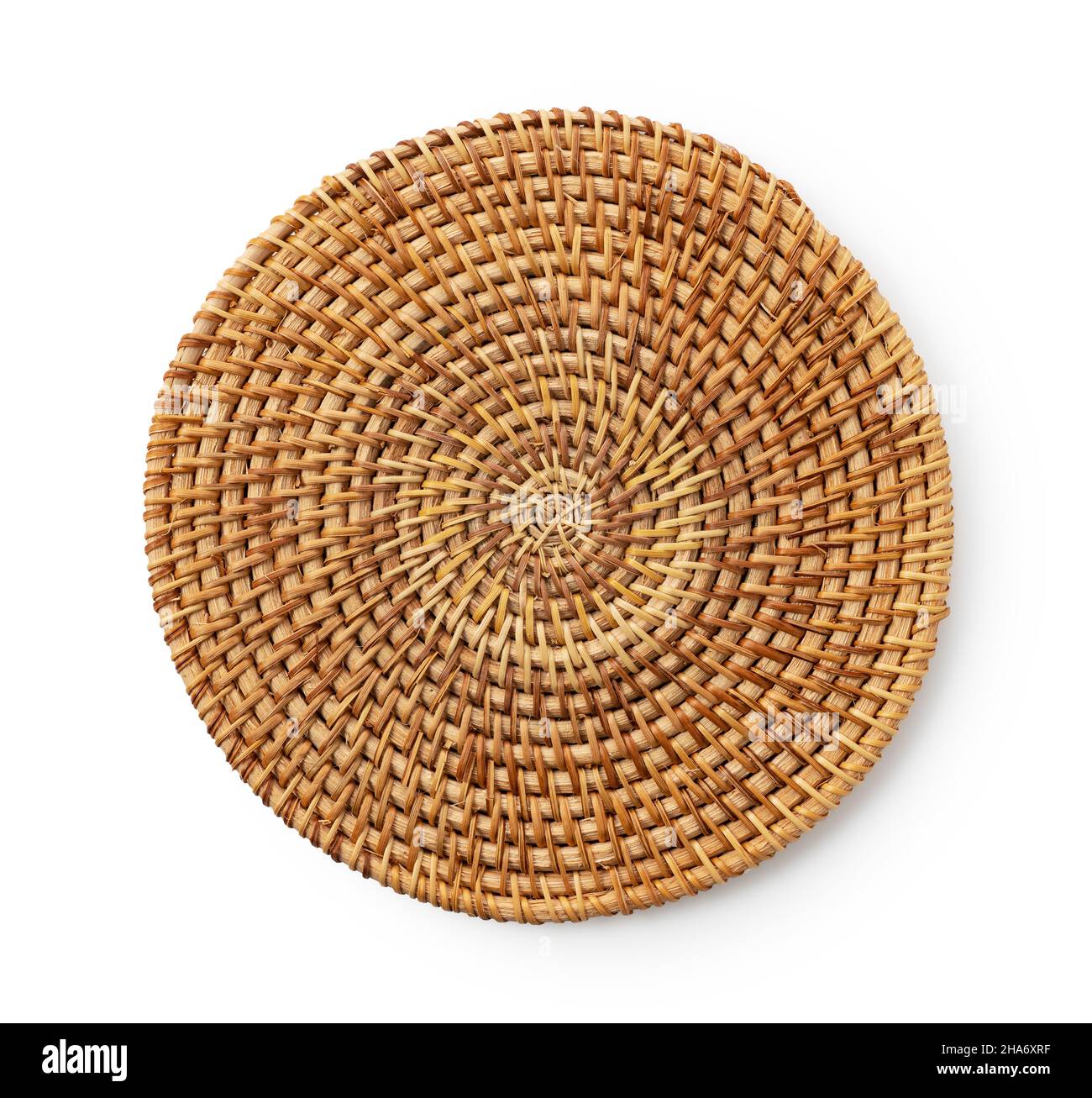 Round woven placemat placed on a white background. View from above ...