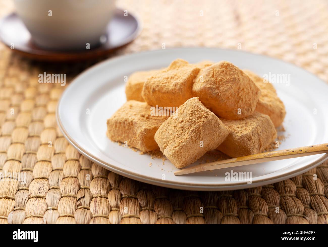 Warabi Mochi and Japanese tea on a Japanese placemat. Warabimochi is a traditional Japanese ...