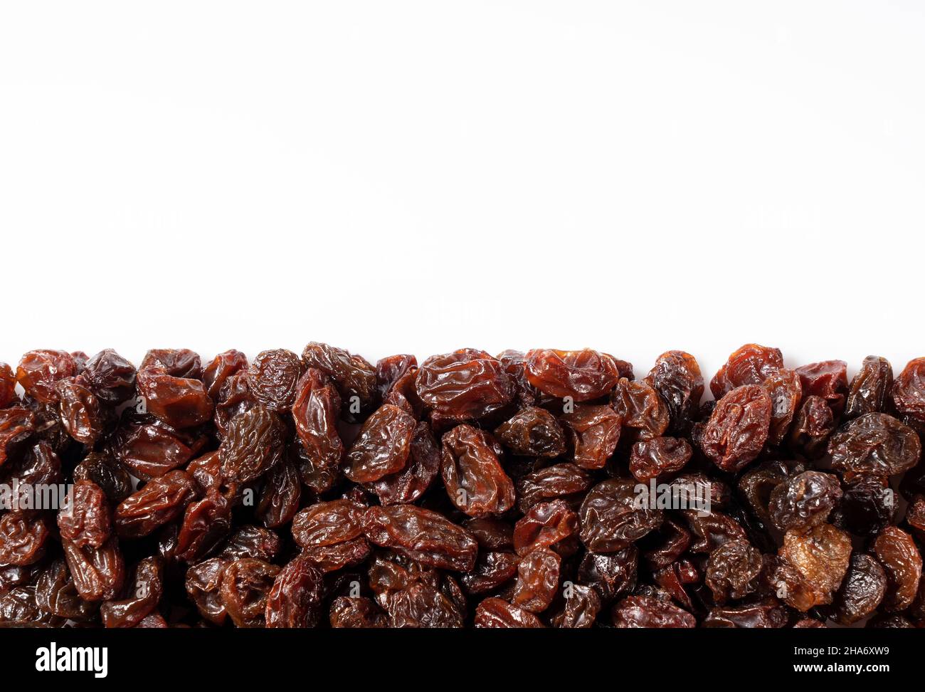 Grape raisin texture on background. White copy space Stock Photo - Alamy