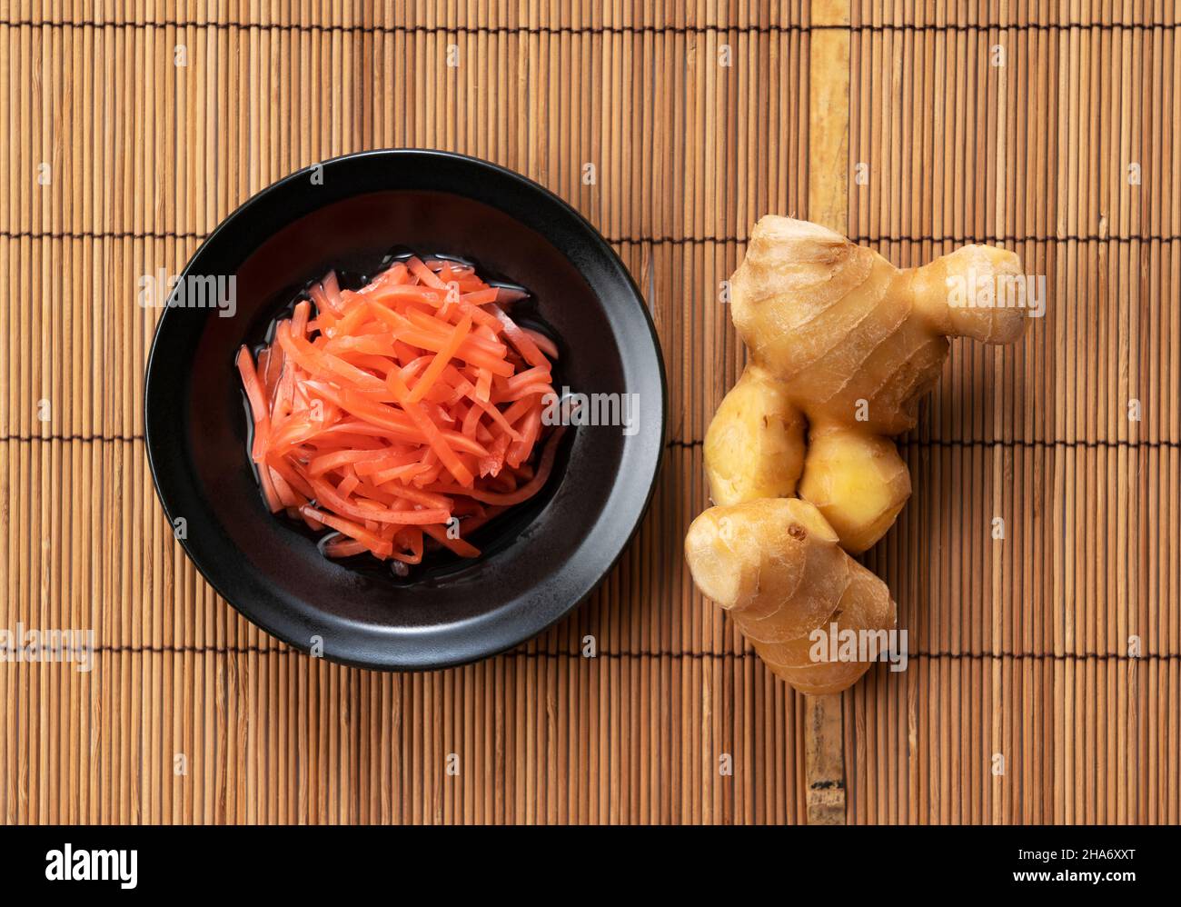 Red pickled ginger placed on a Japanese style background. View from ...