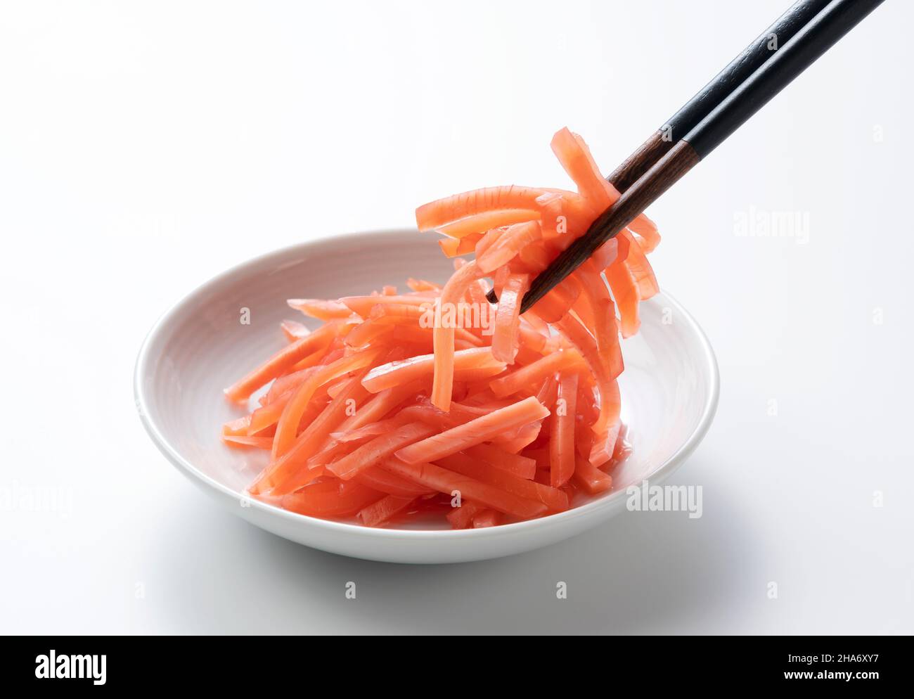 Red ginger placed on a white background. Red pickled ginger in Japan ...