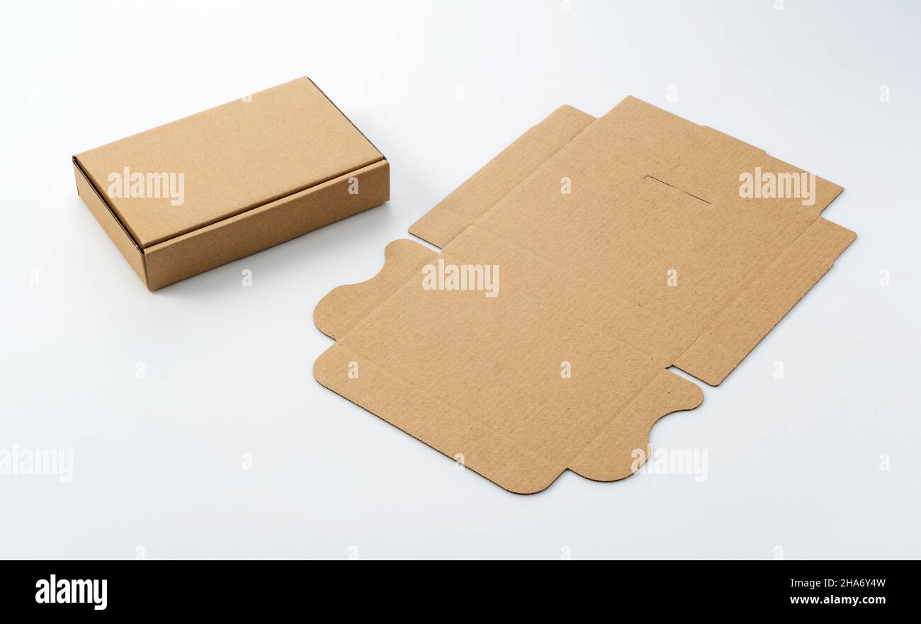 Cardboard box on white background. Before assembly and finished box ...