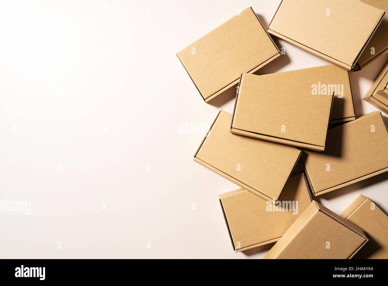 Cardboard boxes placed on a beige background. View from directly above ...