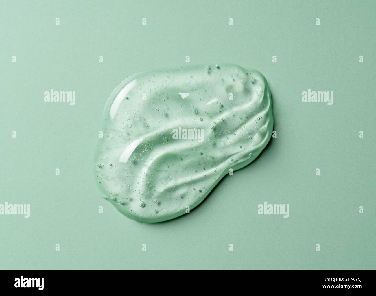 Transparent gel drop on green background. Liquid gel texture. Beauty ...