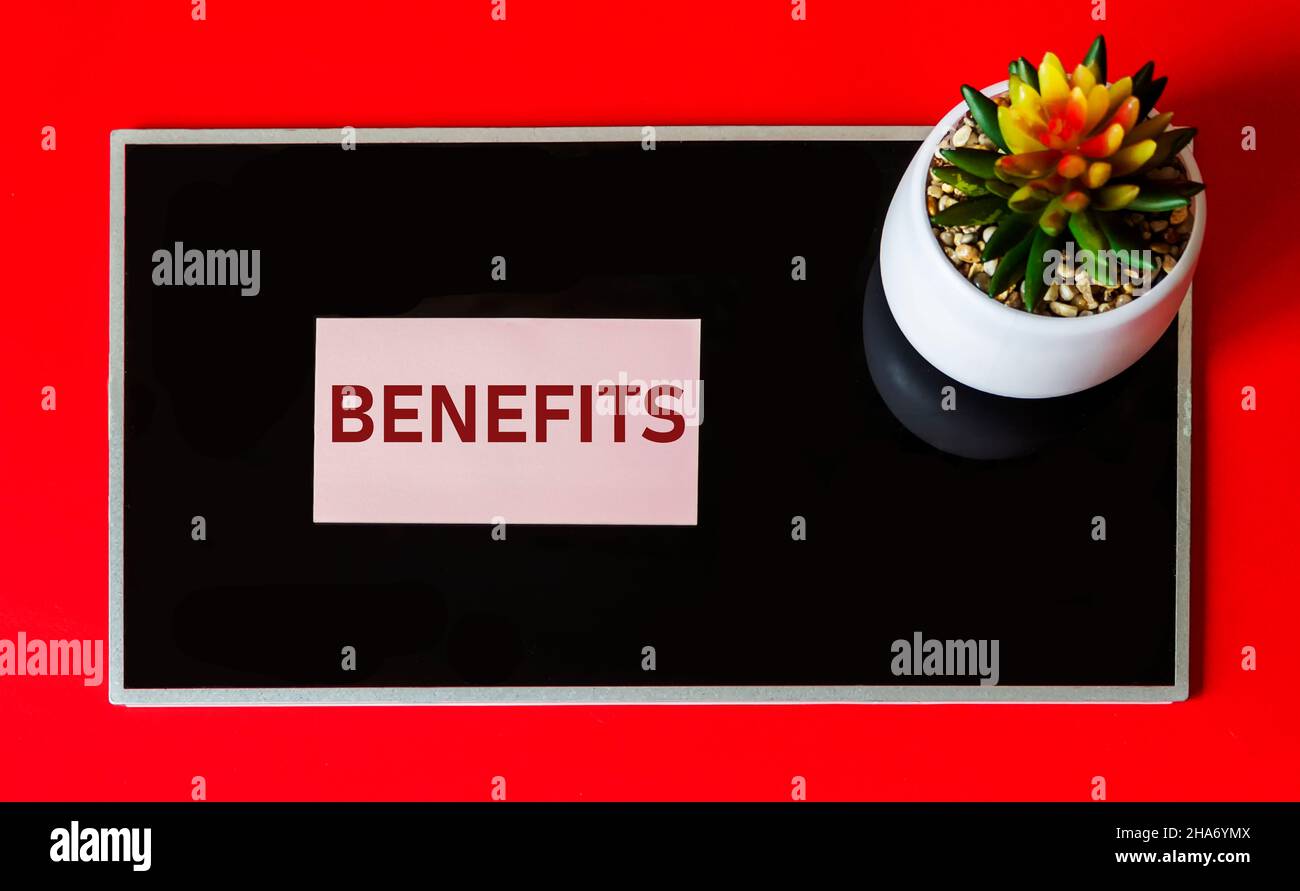 Word BENEFITS on sticker and black mirrored background with cactus ...
