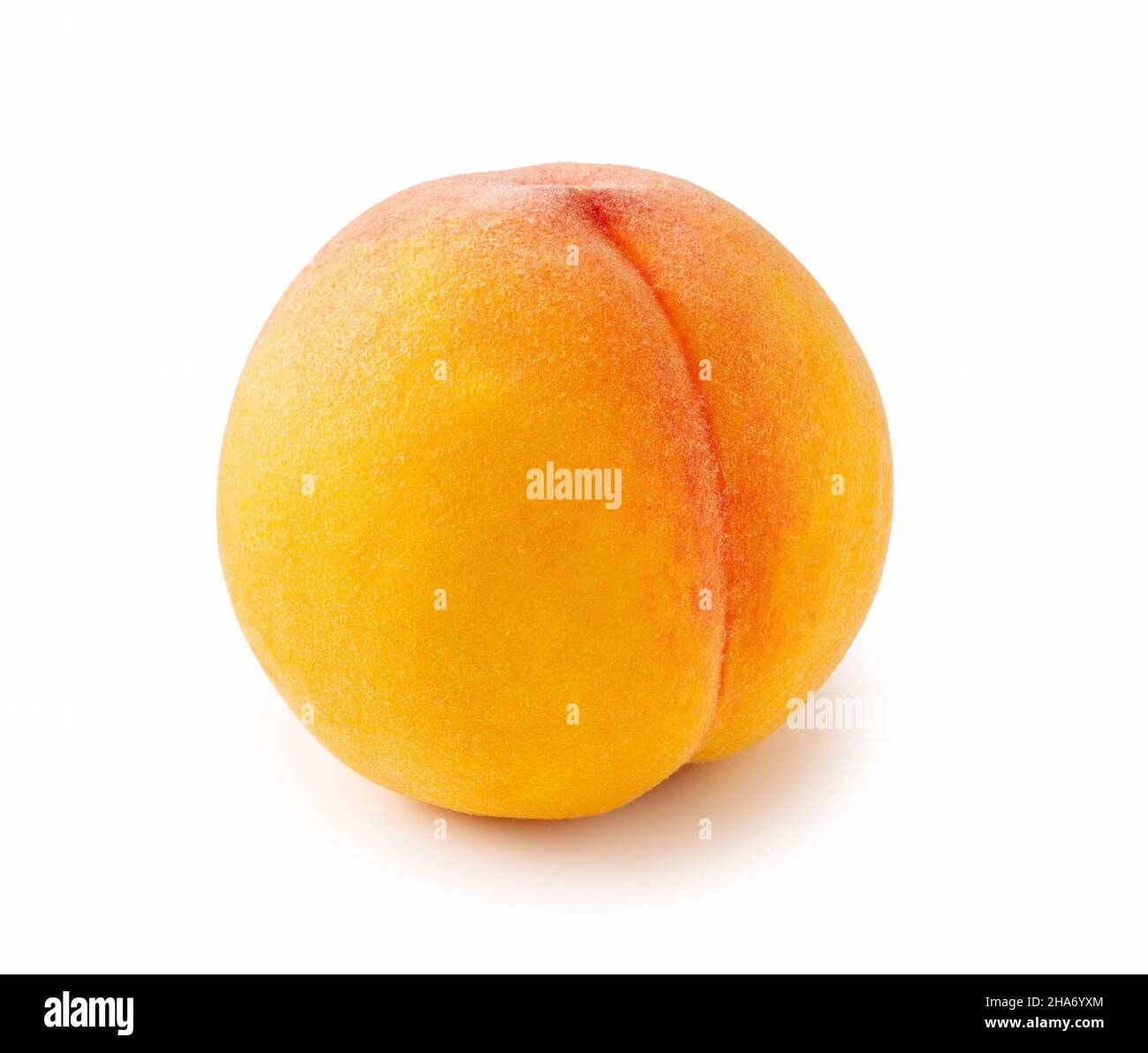 One yellow peach on a white background Stock Photo - Alamy
