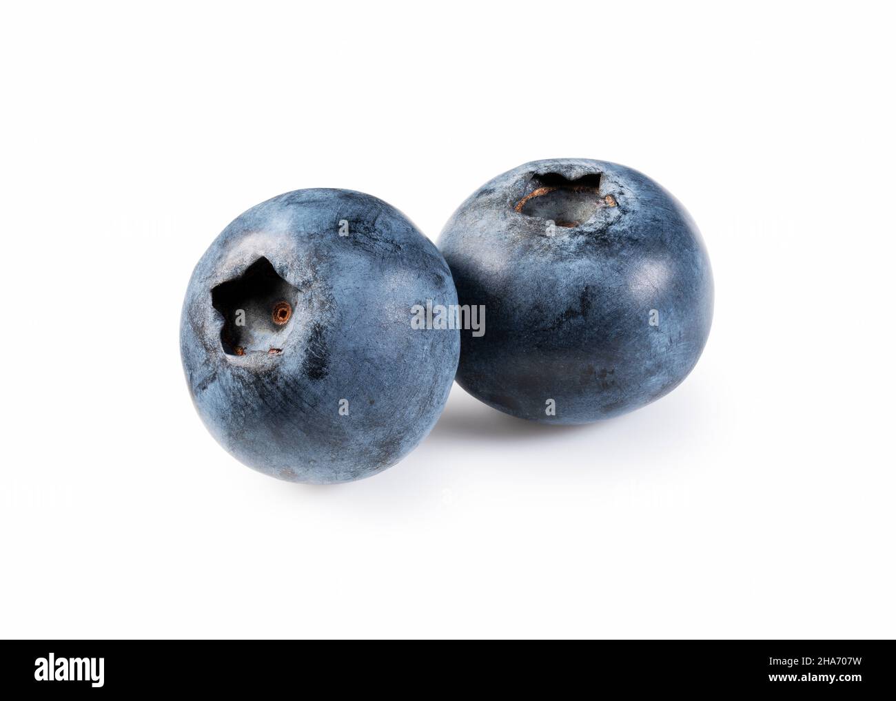 Two blueberries on a white background Stock Photo - Alamy