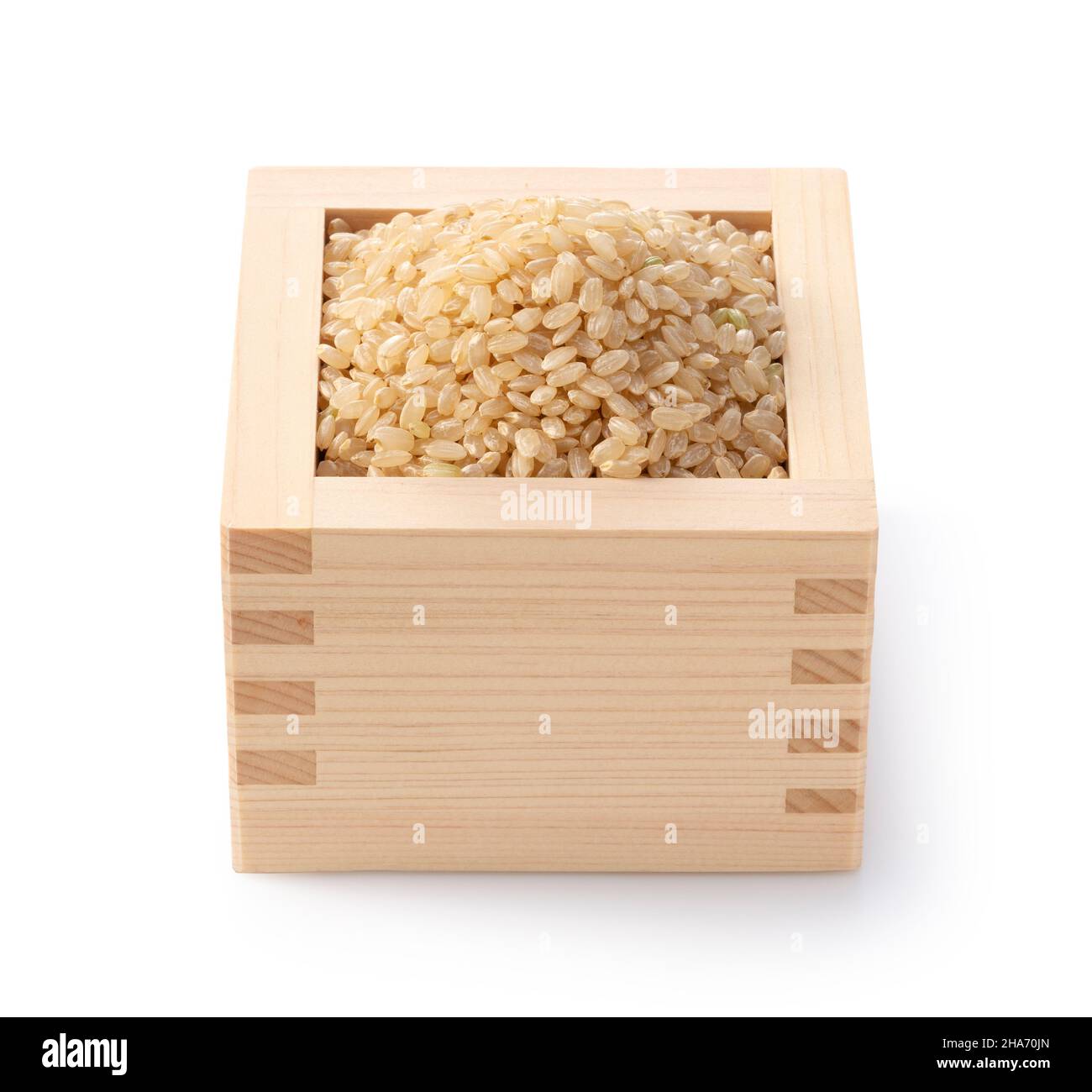 Brown rice in a wooden box set against a white background Stock Photo ...