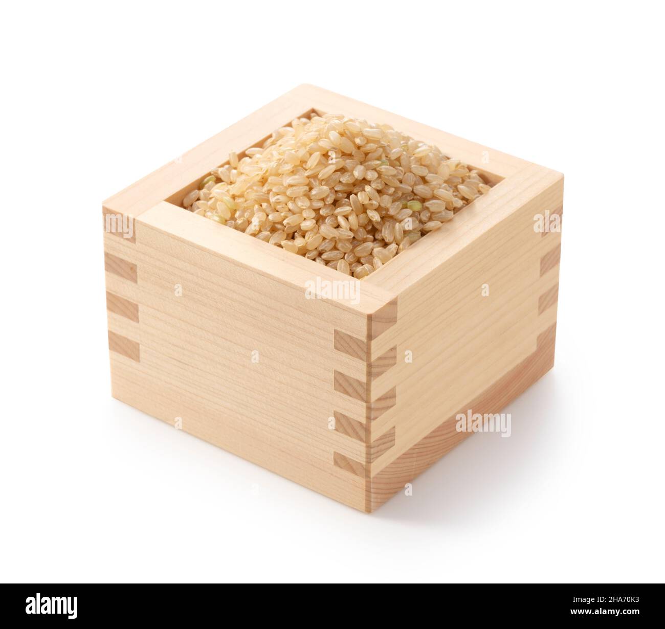 Brown rice in a wooden box set against a white background Stock Photo ...