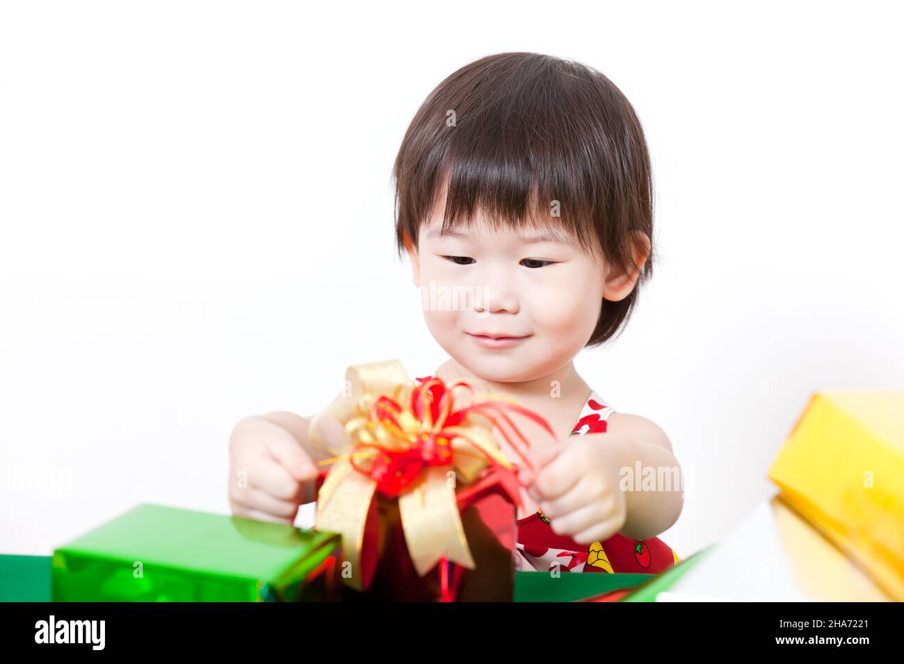 Cute little asian girl is happy with beautiful gift box on table, on ...