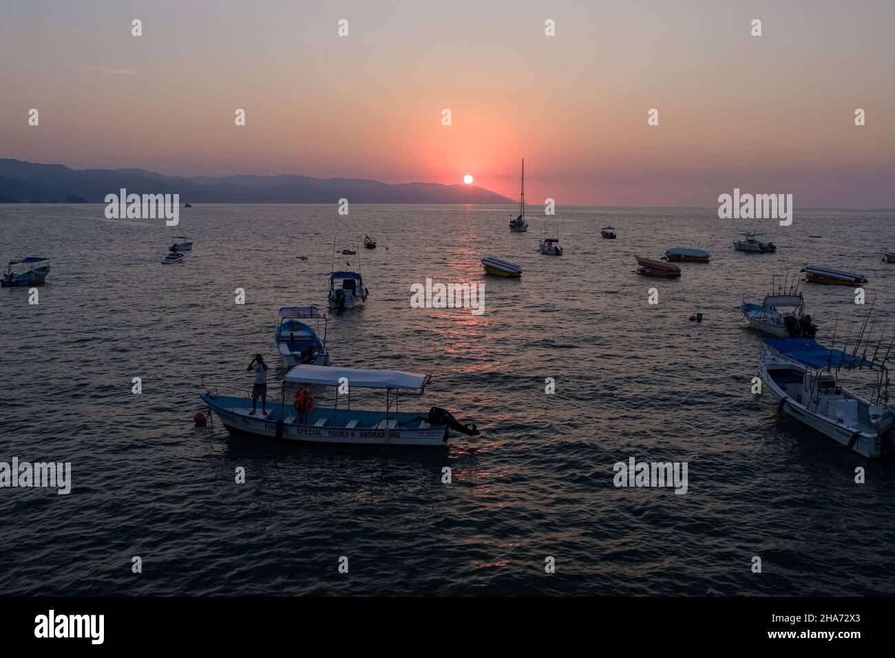Mexican vacation Puerta Vayarta Mexico sunset and fishing boats Stock ...
