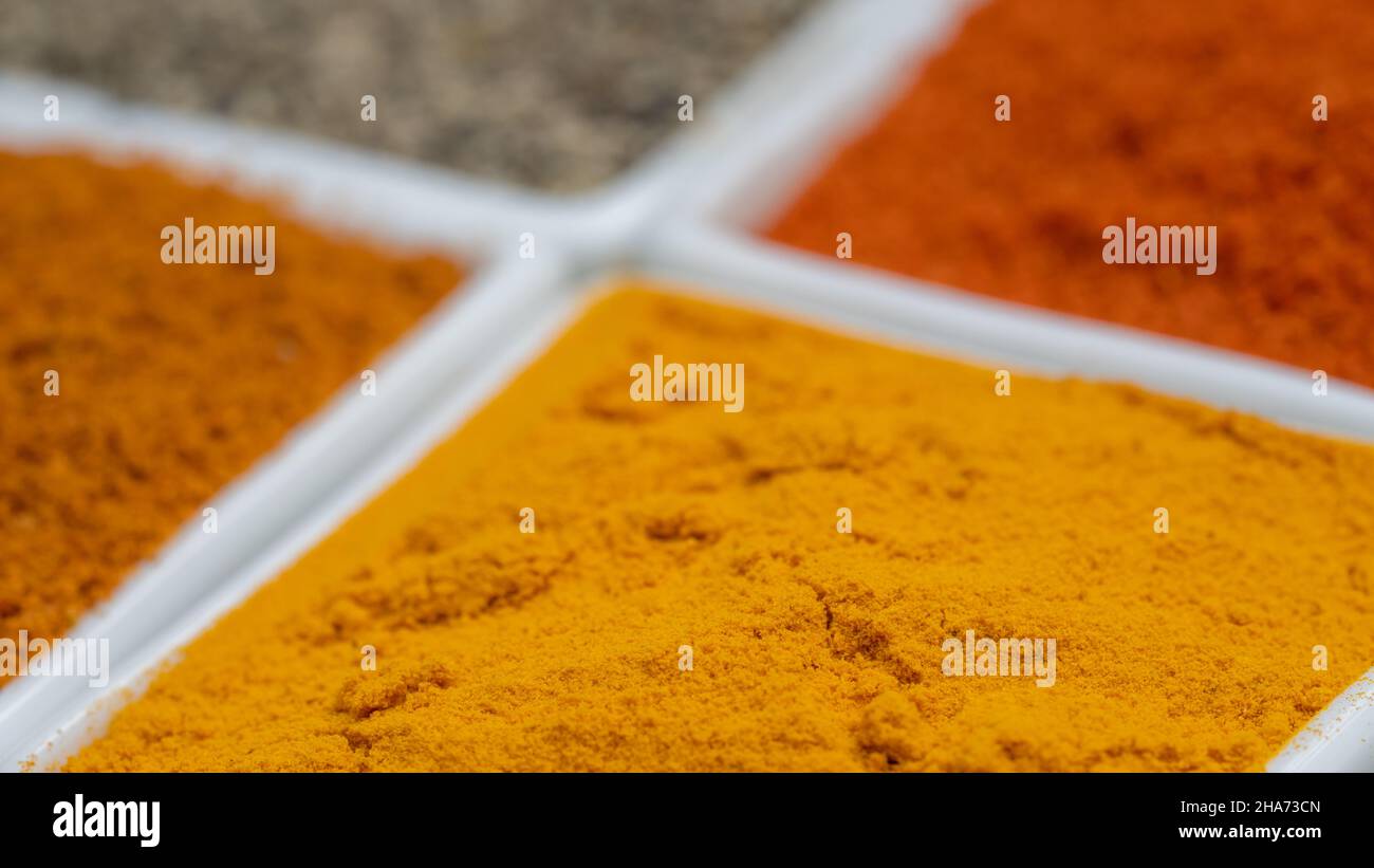 Close up Colorful spices for cooking: Chilli, turmeric,pepper, curry ...