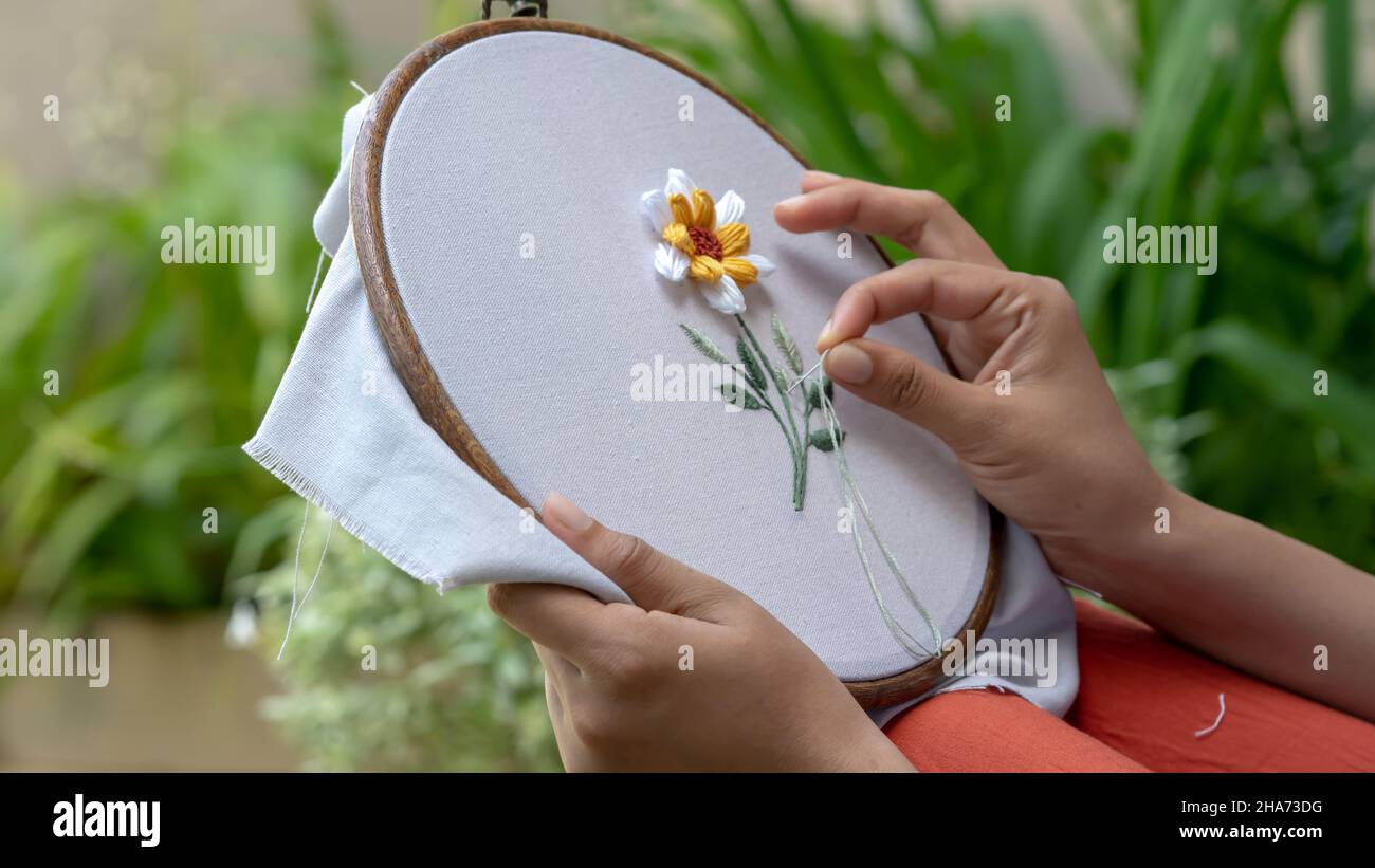 Women's hand stitching flowers, Relaxing and creative art for healthy ...