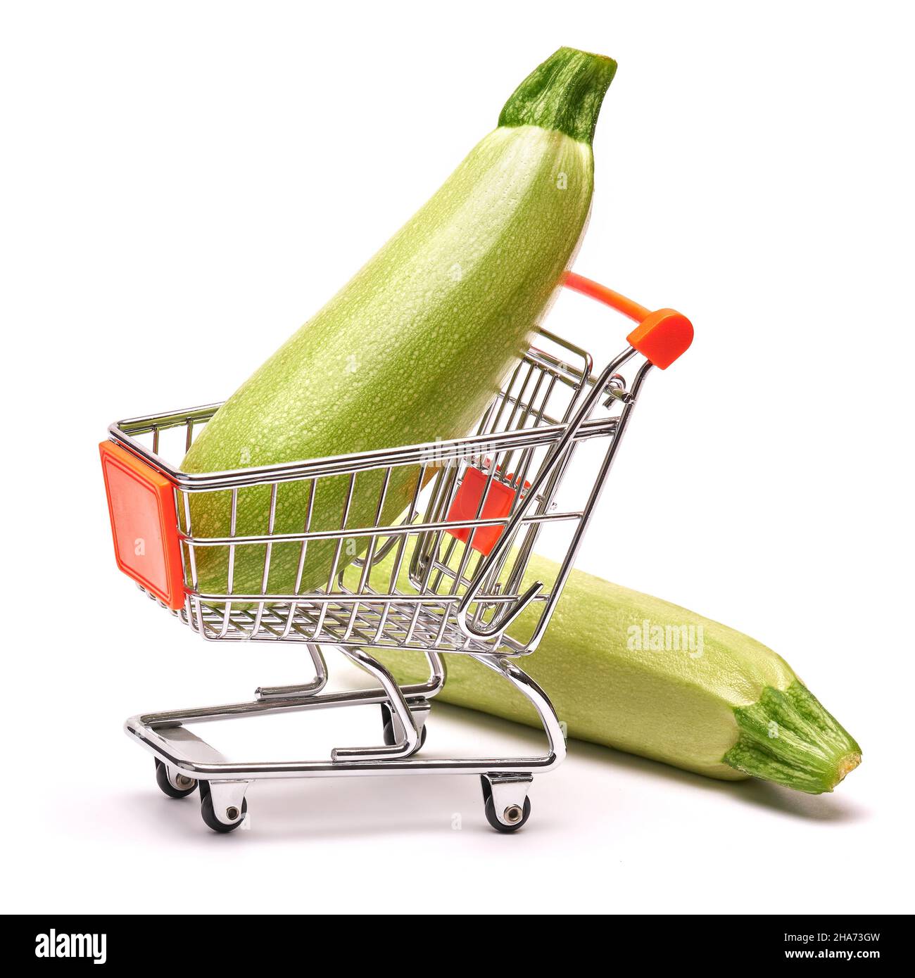 Studio shot of zucchini marrow in shopping cart isolated on white ...