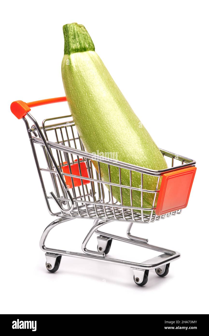 Studio shot of zucchini marrow in shopping cart isolated on white ...