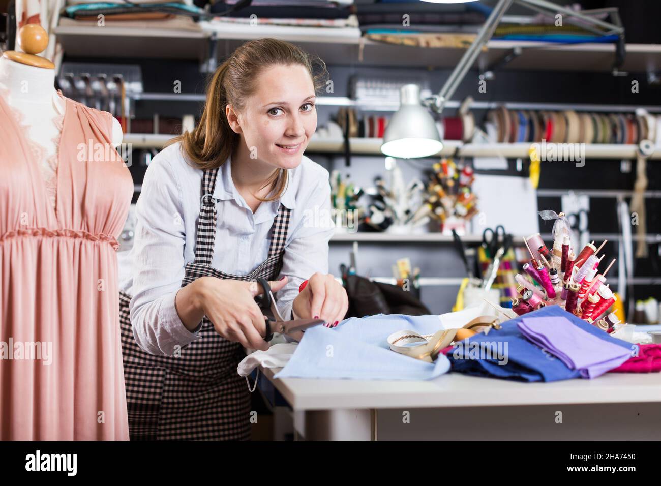 Woman is doing modern patterns for new fashion collection in the ...
