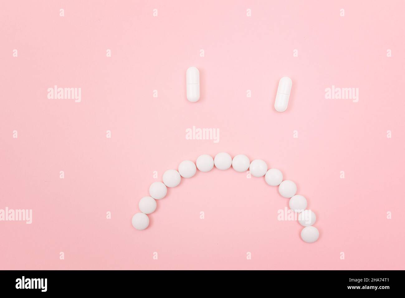 Pharma Harm. Sad Smiley Face Made from White Pills, Lying on Pink ...