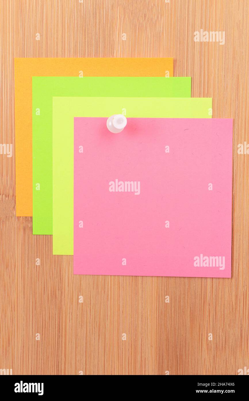 Colored Sticky Notes with Copyspace Pinned to the Wooden Message Board ...