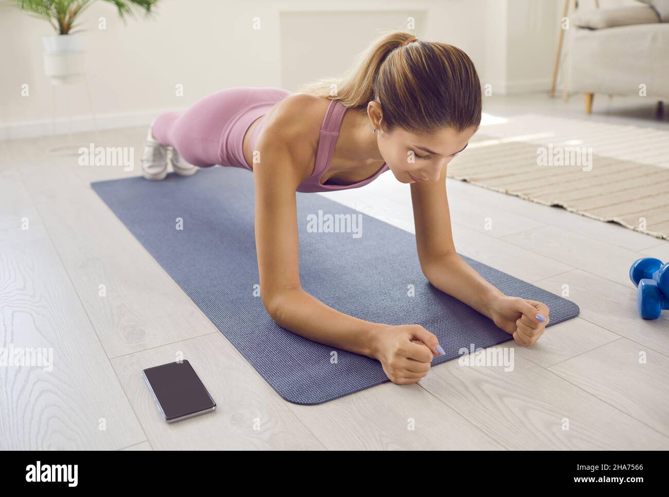 Fit woman train workout at home Stock Photo - Alamy