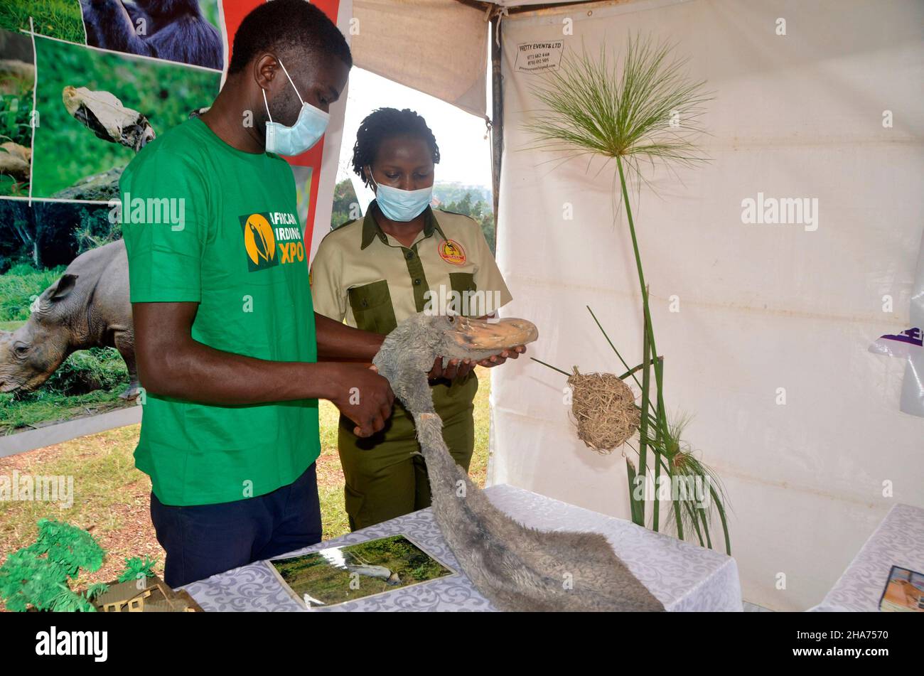 Kampala, Uganda. 10th Dec, 2021. Visitors look at a shoebill specimen ...