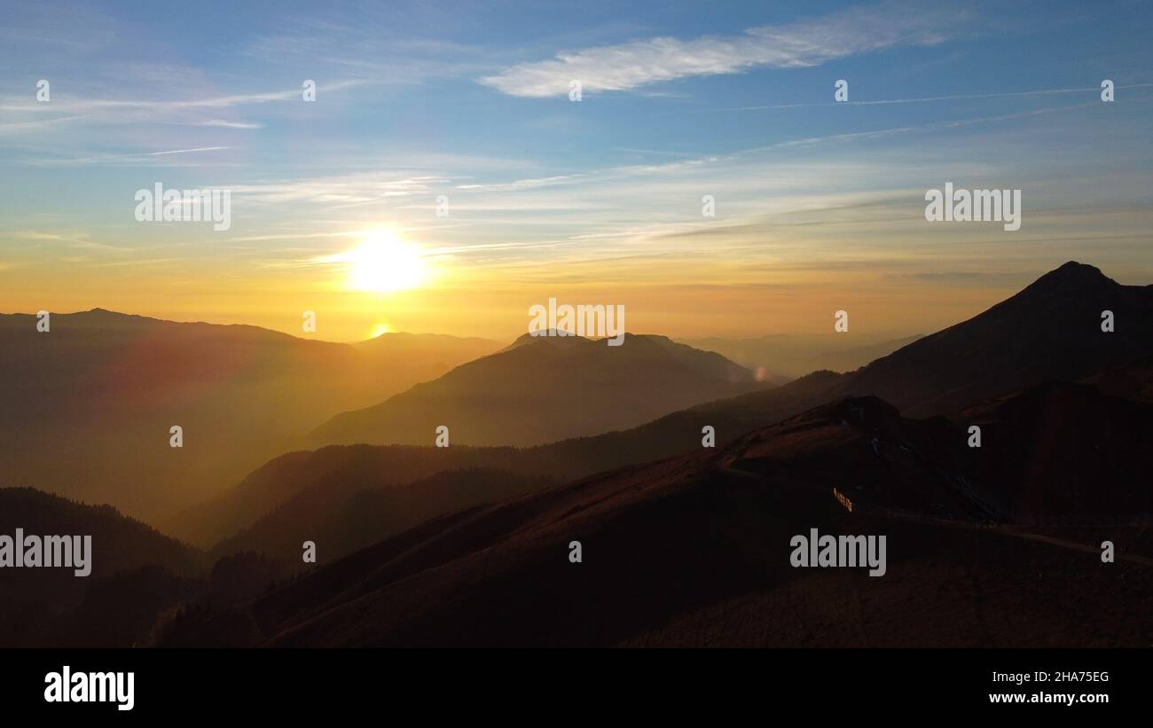 Beautiful mountain landscape in the rays of the setting sun. Beautiful ...