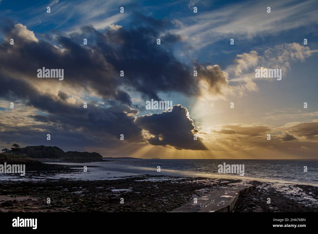 Crepuscular rays trying to break through the cloud cover Stock Photo ...