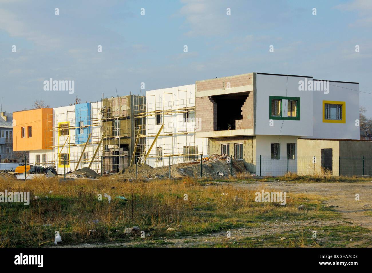 Colorful unfinished building construction. Two story building Stock ...