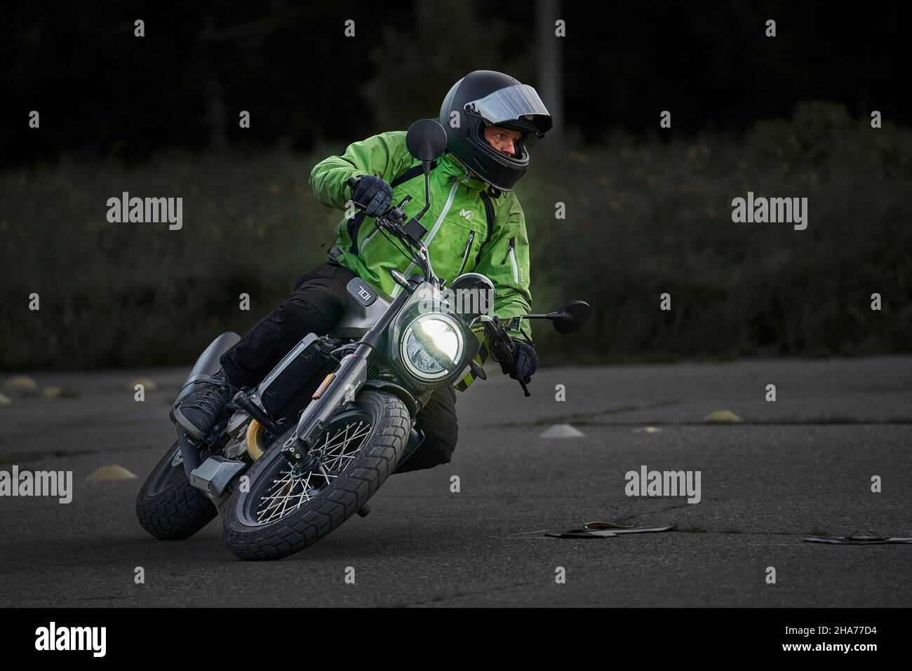 19-09-2021 Riga, Latvia A young man riding a motorcycle on an open road ...