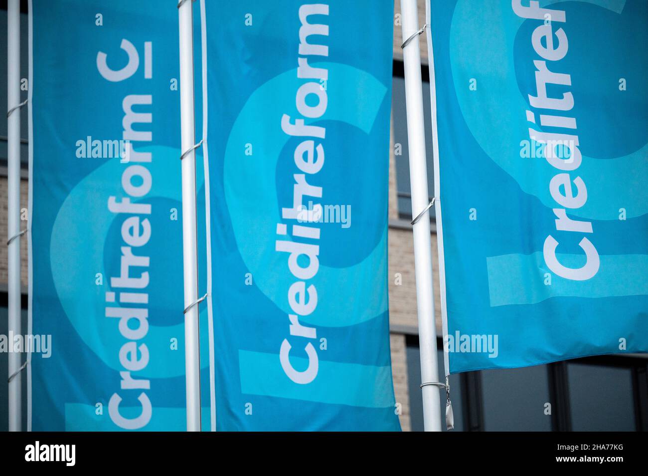 Neuss, Germany. 09th Dec, 2021. Flags bearing the Creditreform name fly ...