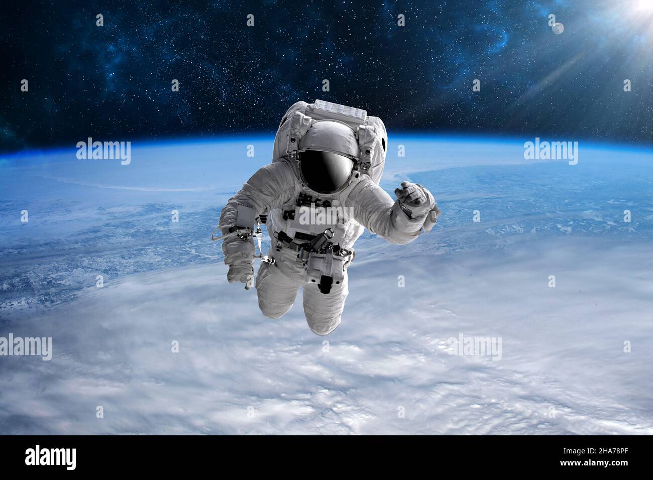 Astronaut in outer open space over the planet Earth.Stars provide the ...