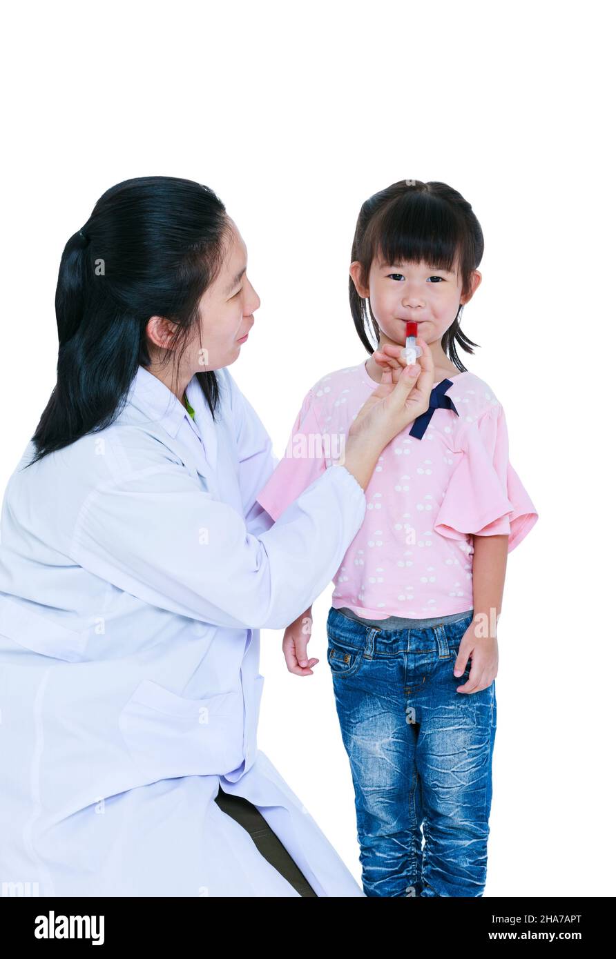 Caring medical doctor giving child medication by syringe. Sick child ...