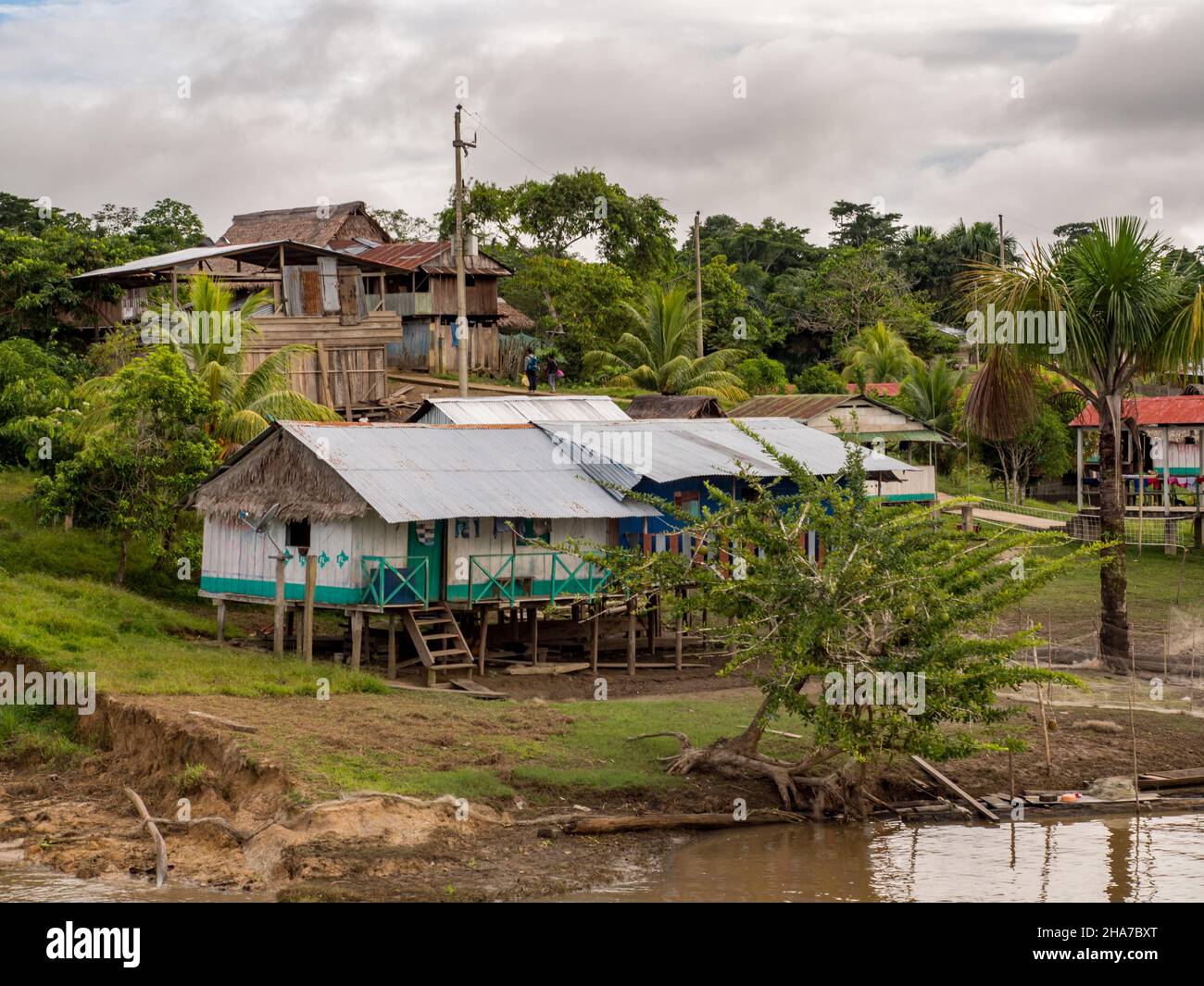Amazon River, Peru - May, 2016: Small village on the bank of the Amazon ...