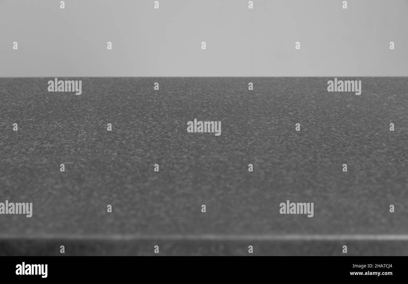 metal gray table surface for background copy-space on gray wall ...
