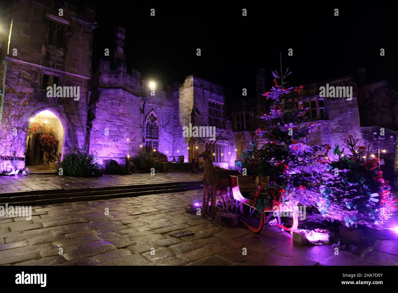 Exterior courtyard Haddon Hall near Bakewell, Derbyshire illuminated at ...