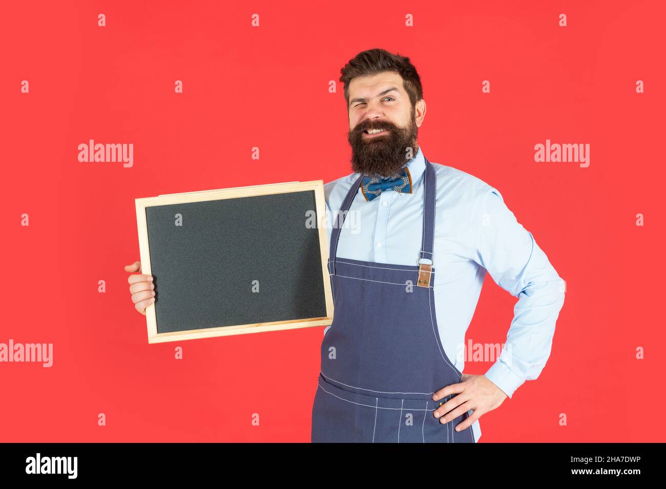 Promotional advertising. Winking man smile holding promo blackboard ...