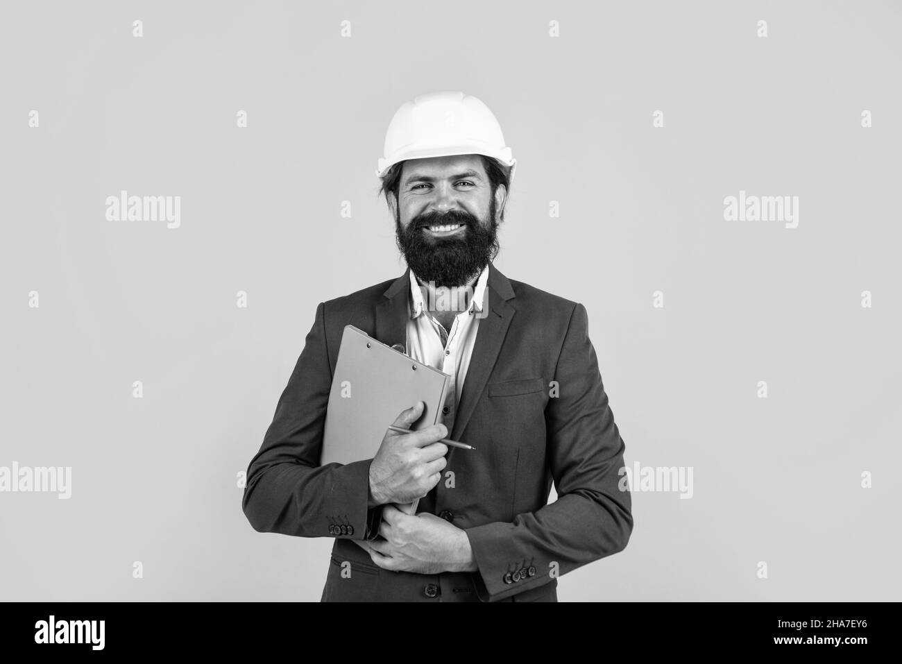 architecture and building. male builder wearing formal suit and helmet ...