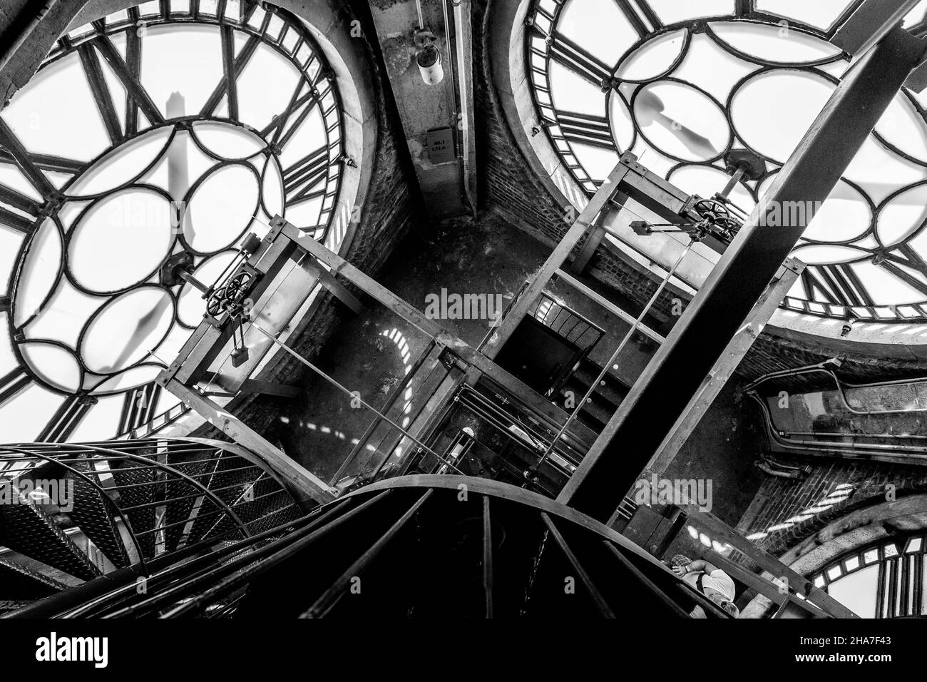 Grayscale of the interior of a clock tower Stock Photo - Alamy