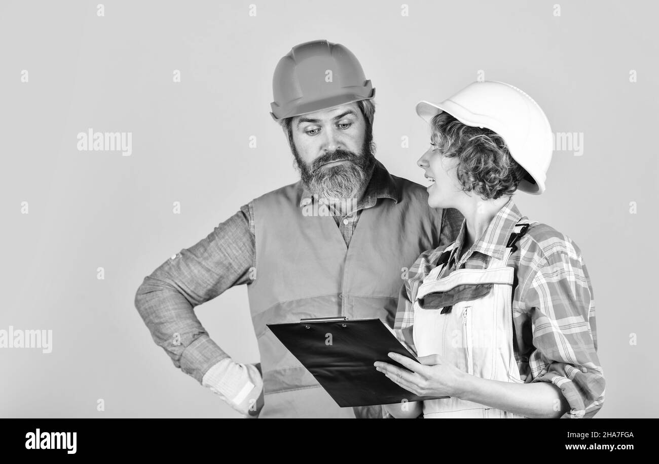 engineers couple working together on building blueprint. work at ...