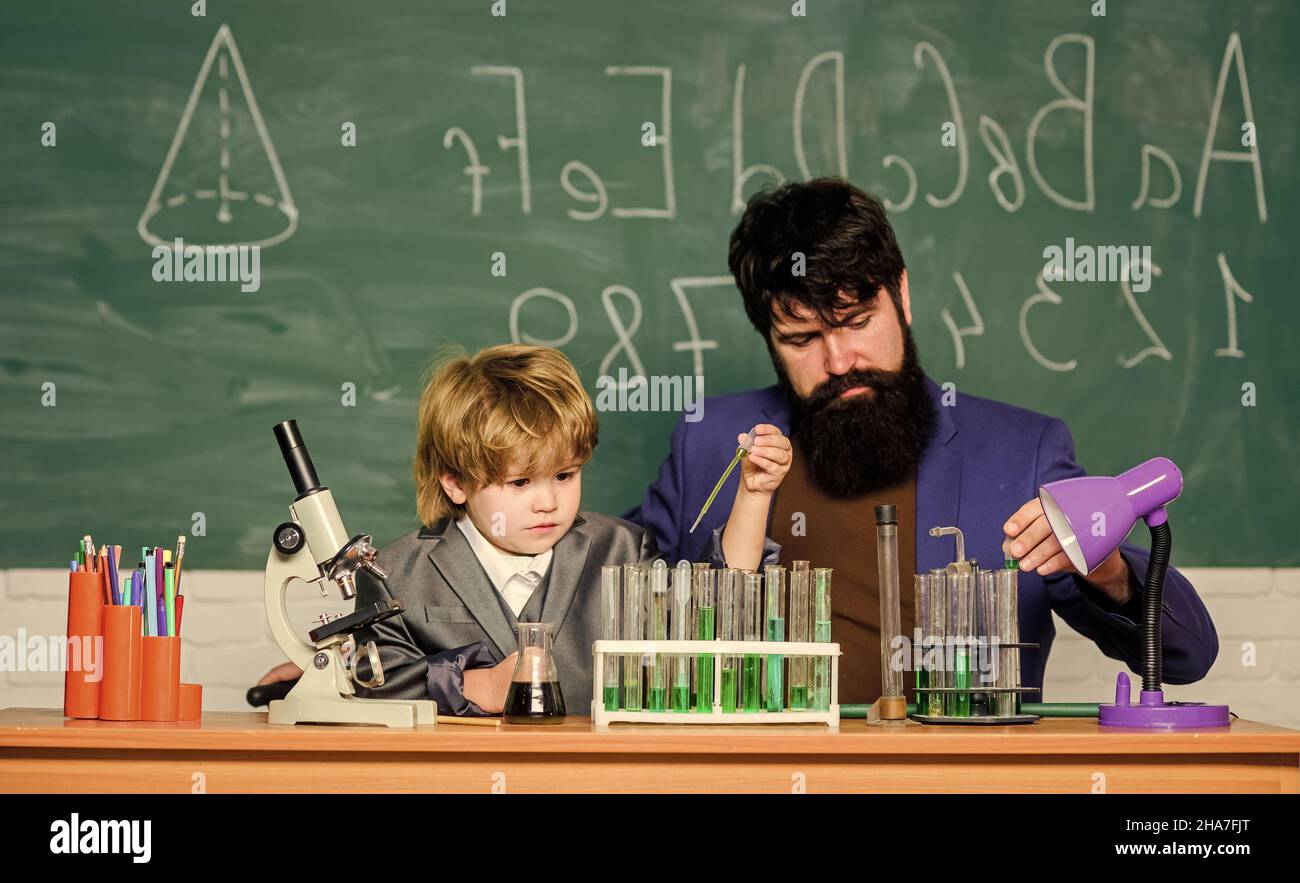 teacher man with little boy. Biology Science lab. Back to school ...