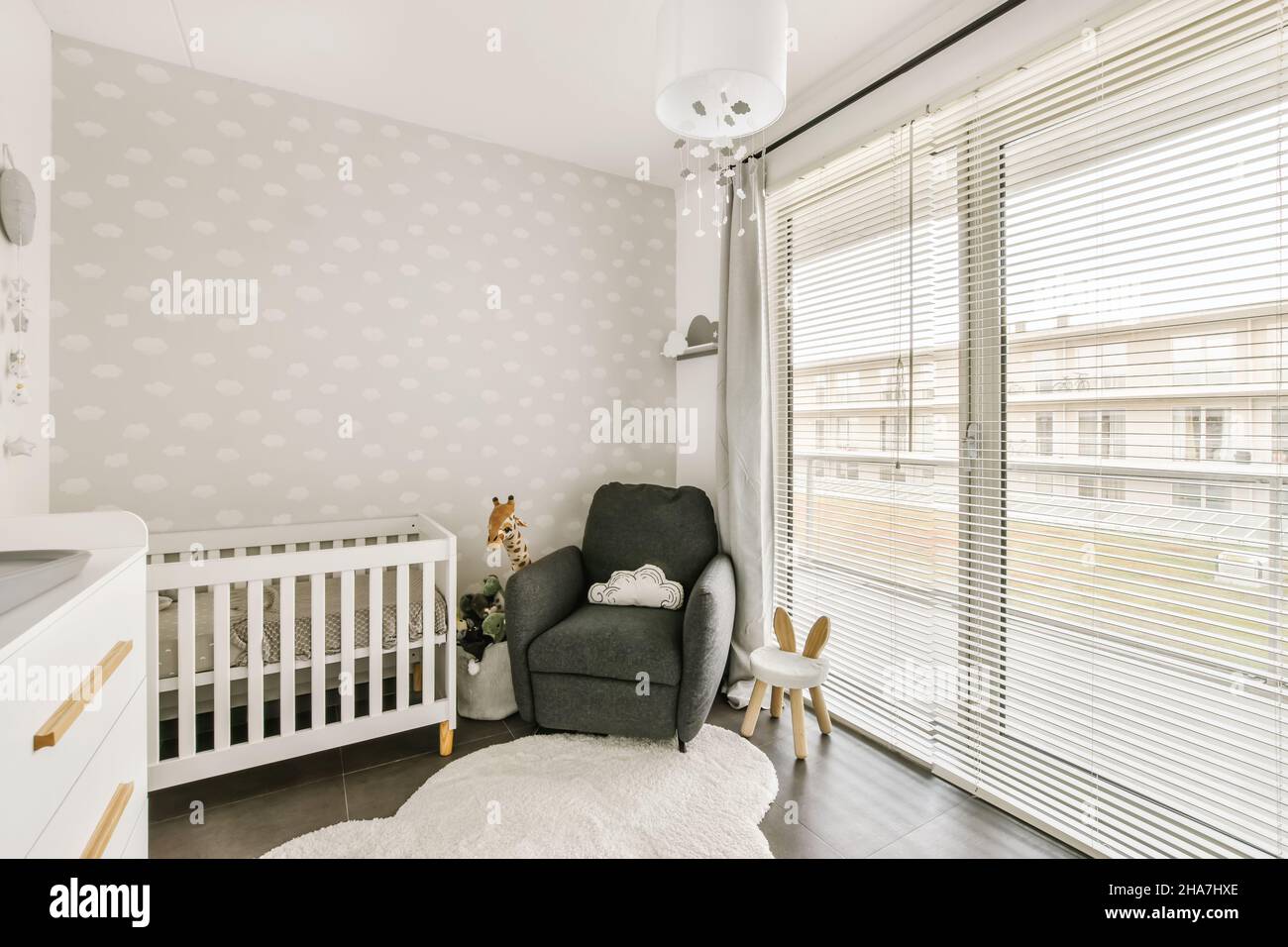 Stunning baby room with white baby crib Stock Photo - Alamy