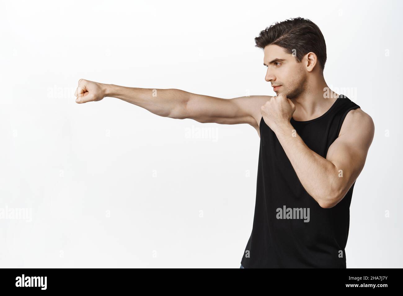 Image of handsome strong male athlete, sportsman wrestle, extending ...