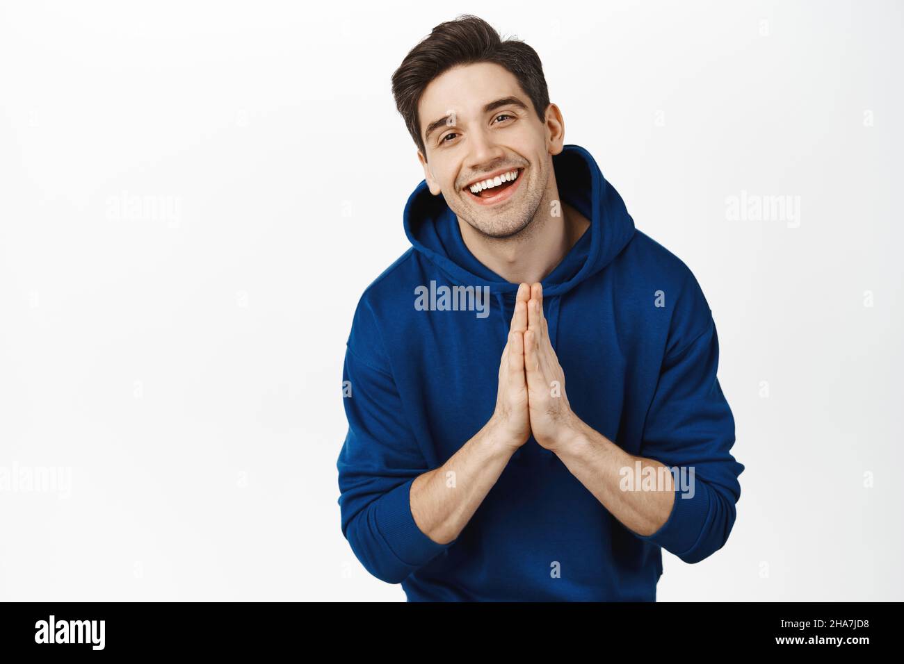 Happy handsome young man smiling, showing thank you namaste gesture and ...