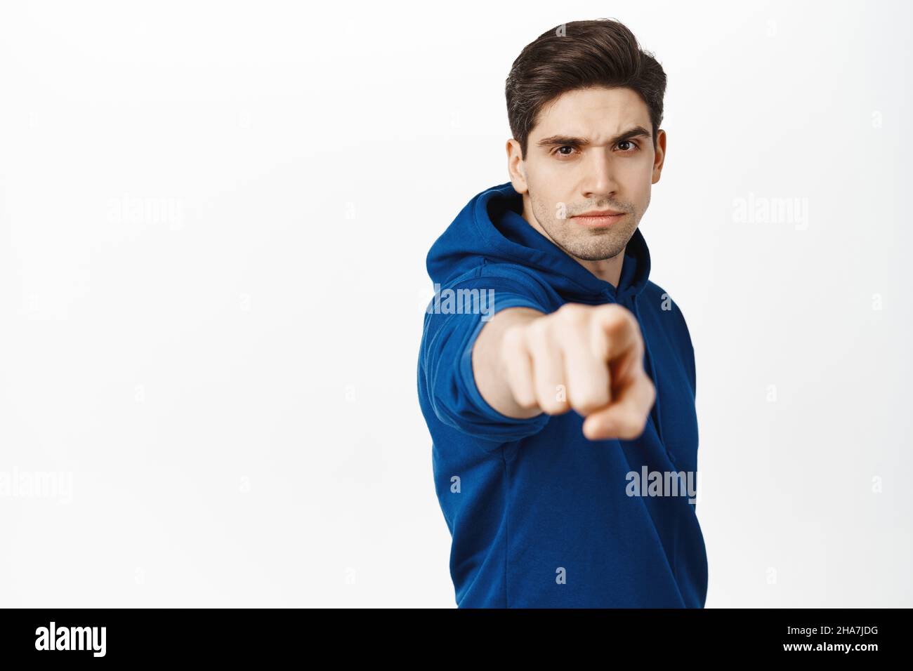 Close up portrait of serious suspicious man pointing finger at camera ...