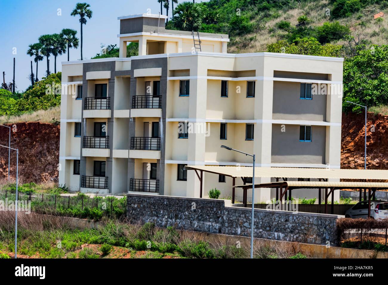 Top view of an Indian colony with bitumen road , building looking in ...